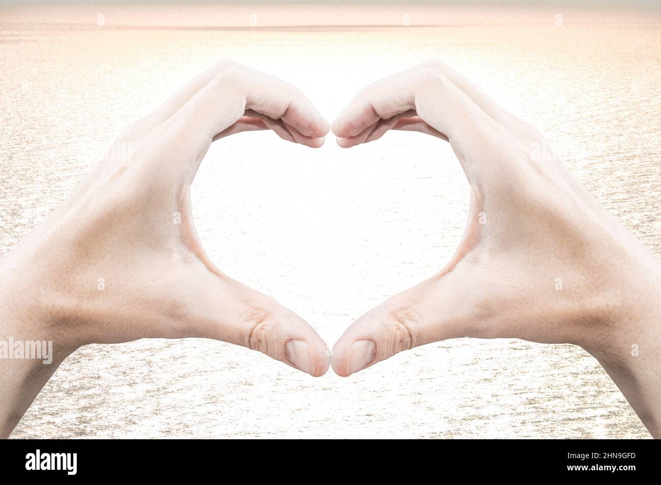 Hands together forming heart hi-res stock photography and images - Alamy