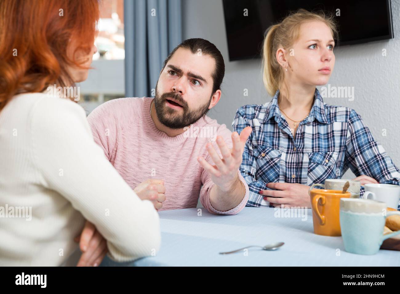 Young serious couple has a family stressful conversation at home Stock Photo - Alamy