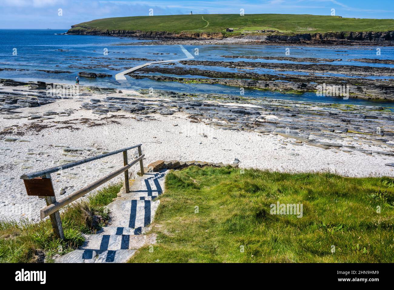 Partly submerged causeway leading to the Brough of Birsay, an ...