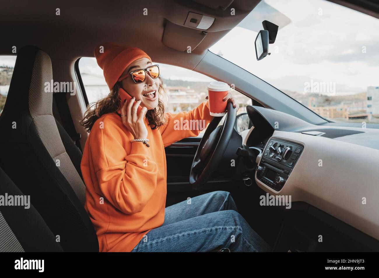 A young student girl was distracted by a coffee drink and talking with ...