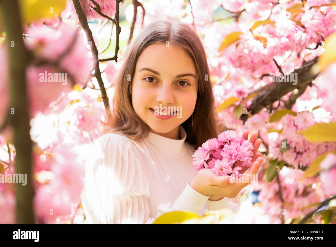 Smiling japanese girl in flowers hi-res stock photography and images ...