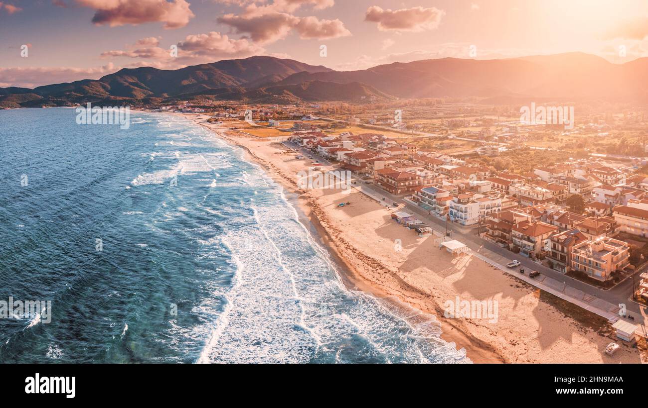 Dramatic panoramic aerial view of iconic Sarti resort town and famous ...