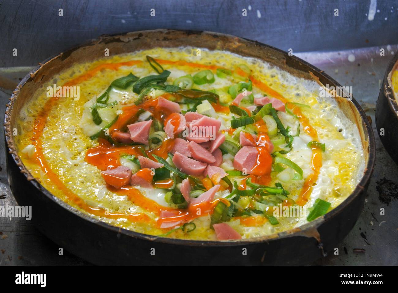 The making of Kue Leker, Indonesian traditional street food. Made from ...