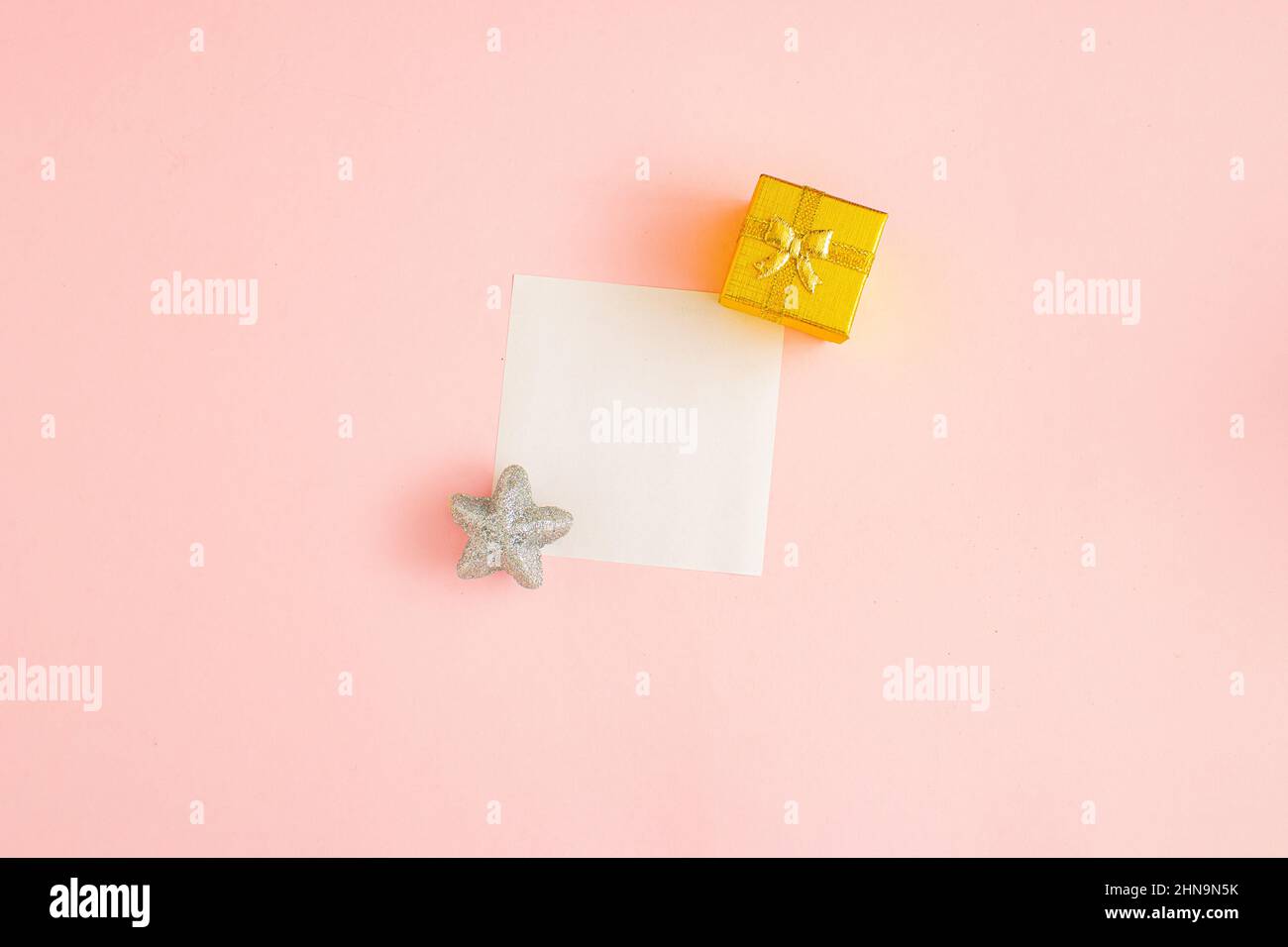 Closeup of Chinese New Year flyer design with a blank paper, a gift box ...