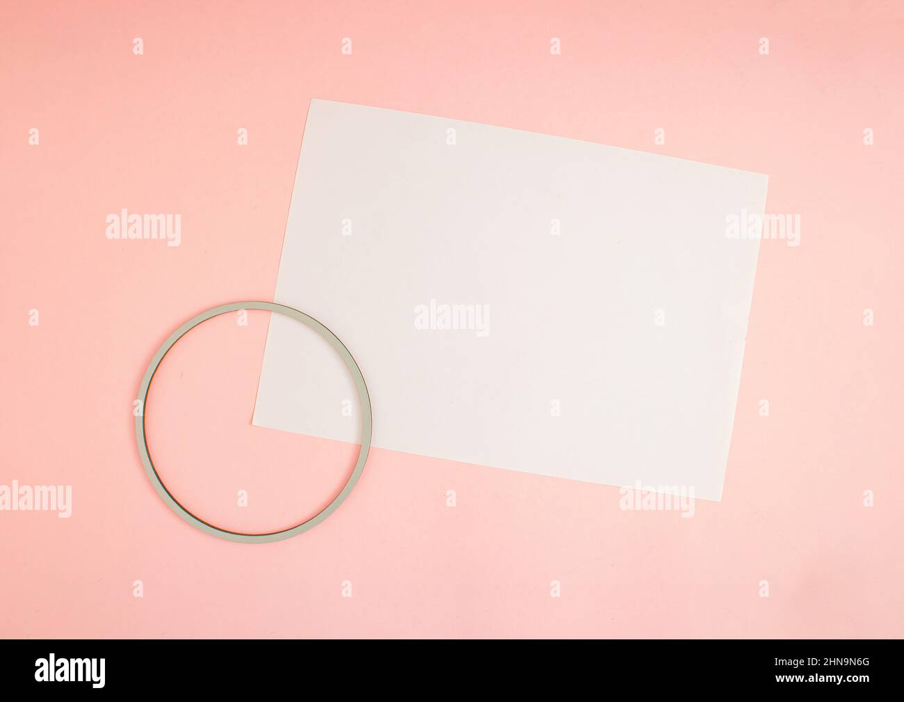 3D rendering of a circle-shaped frame and square blank paper against a ...