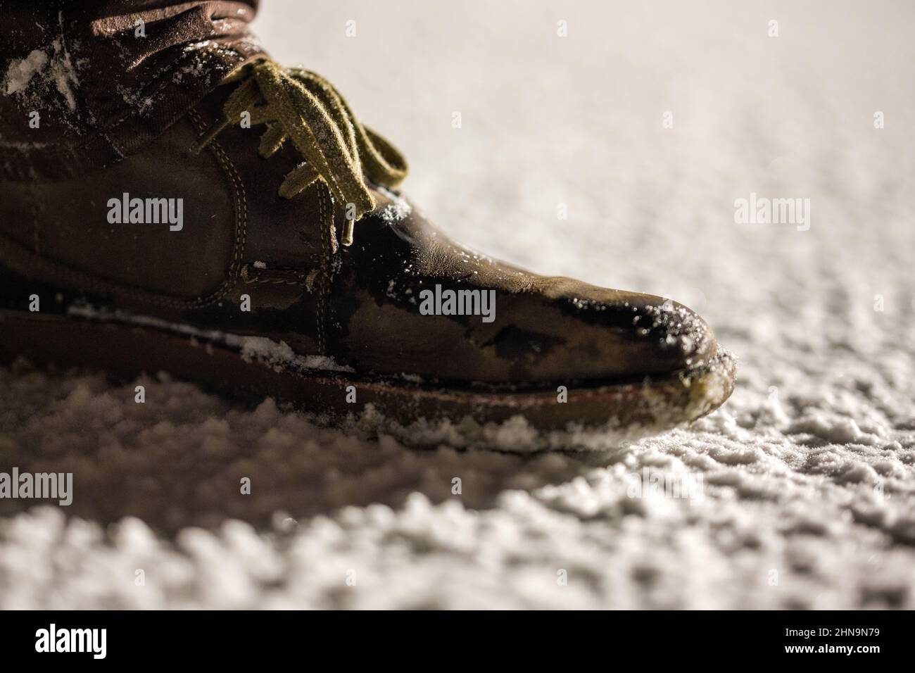 Close-up shot of man's boot on the snow Stock Photo - Alamy