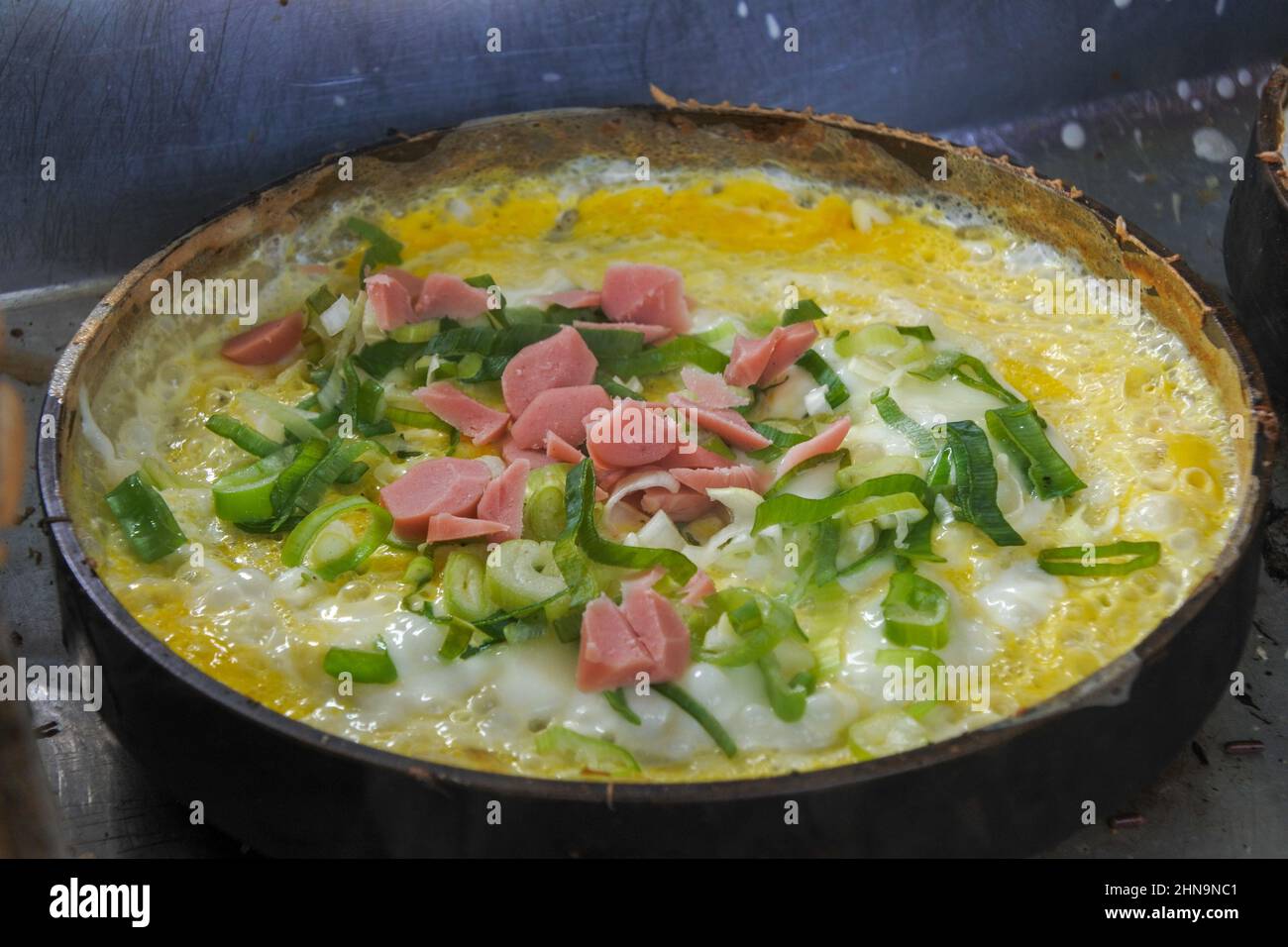 The making of Kue Leker, Indonesian traditional street food. Made from ...