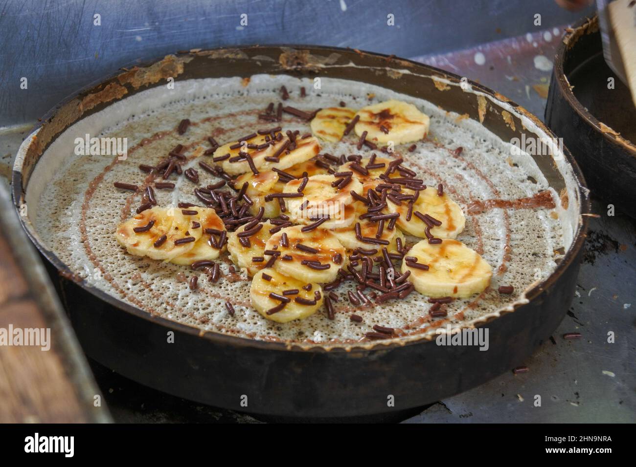 The making of Kue Leker, Indonesian traditional street food. Made from ...