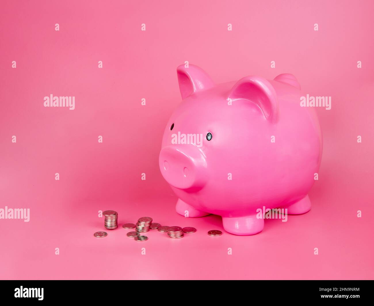 Pink piggy bank ceramic money coins toy on pink background Stock Photo ...