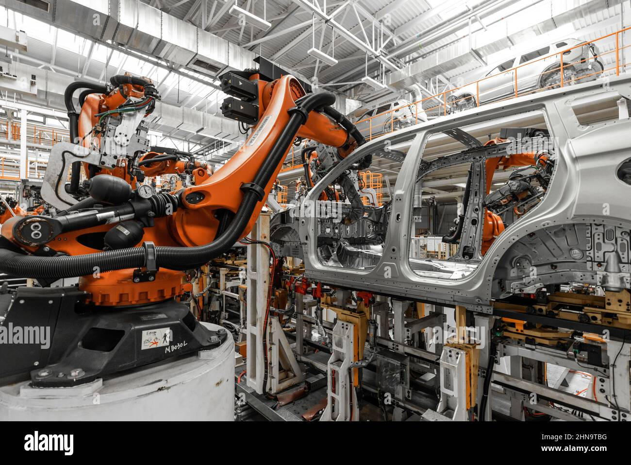 Photo of automobile production line. Welding car body. Modern car ...