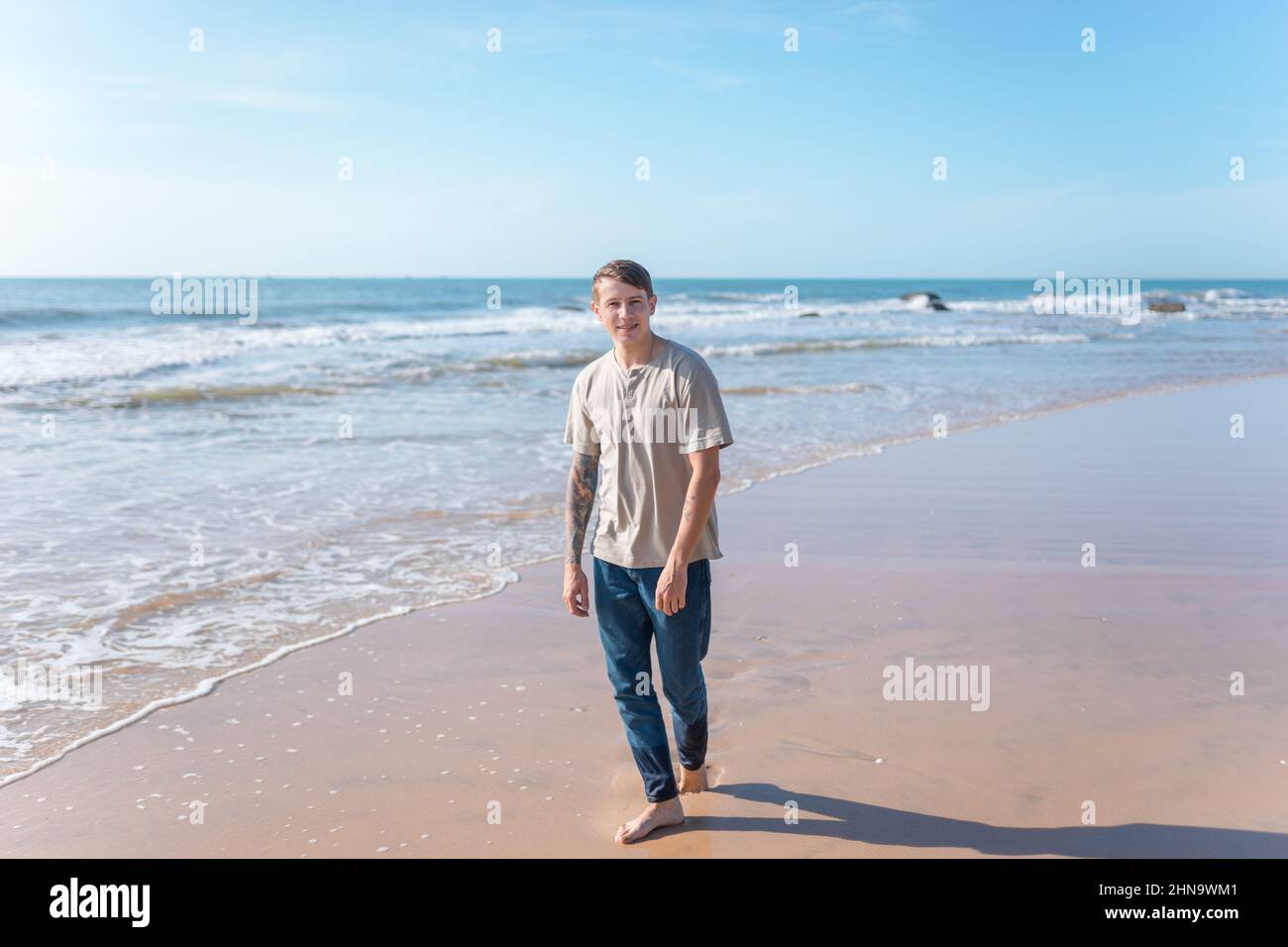 Barefoot man jeans hi-res stock photography and images - Alamy