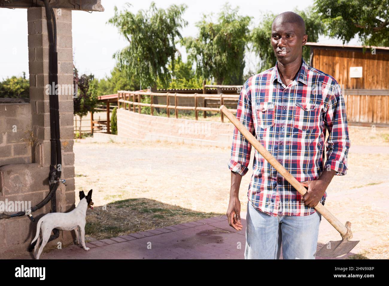 Adult man farmer rake hi-res stock photography and images - Alamy