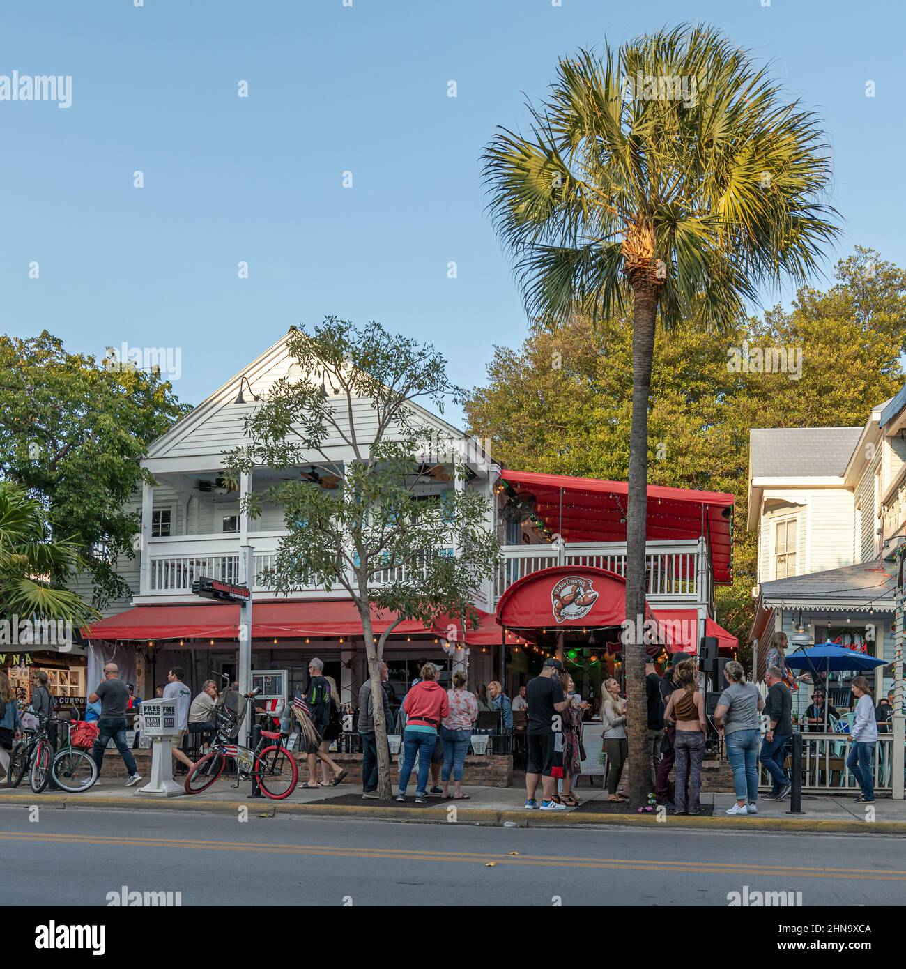 A crowd of people on the street outside of the Stinkin' Crawfish Canjun ...