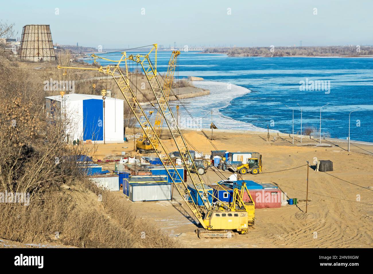 View of the construction site with equipment on the banks of the big ...