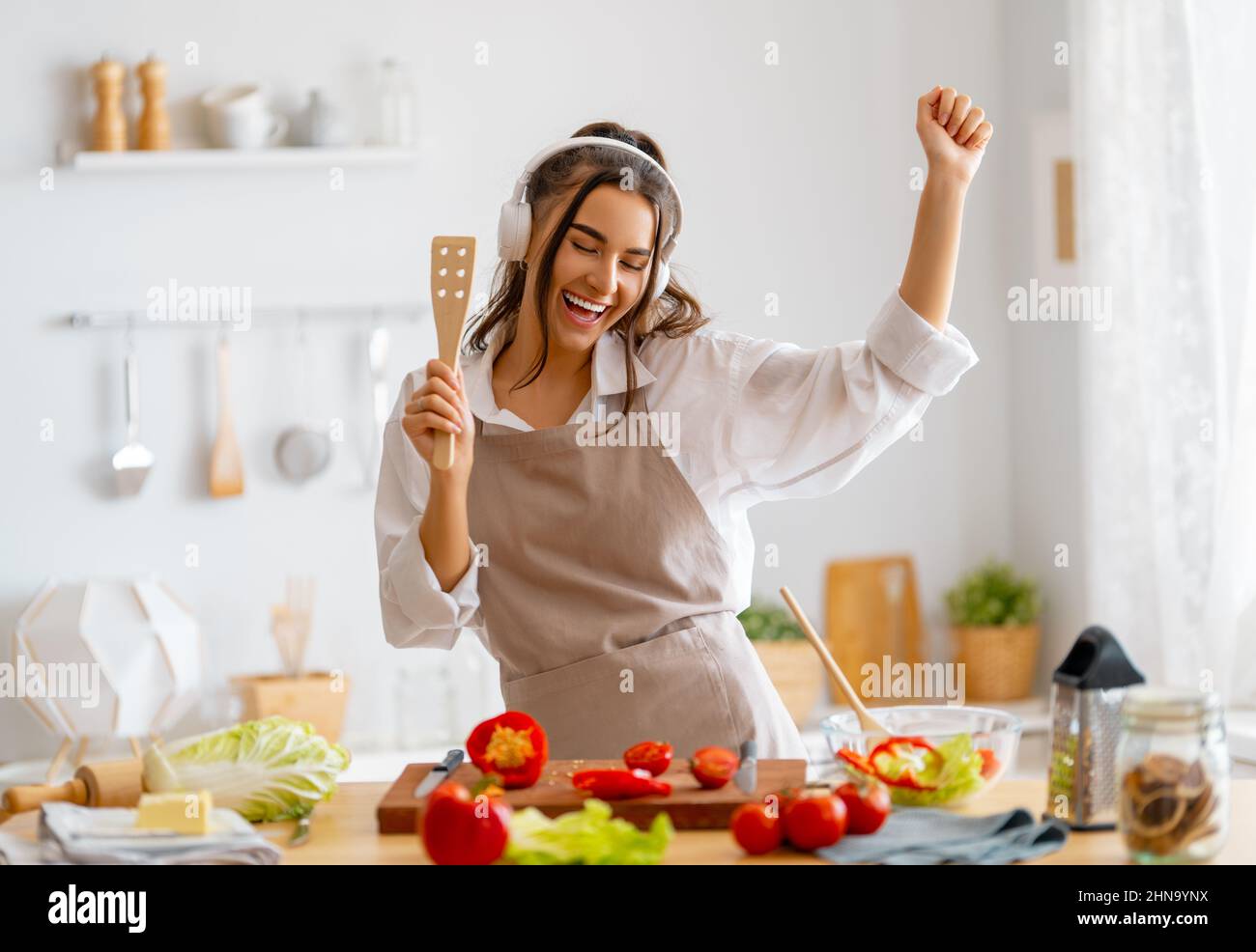 Healthy food at home. Woman is preparing the proper meal in the kitchen ...
