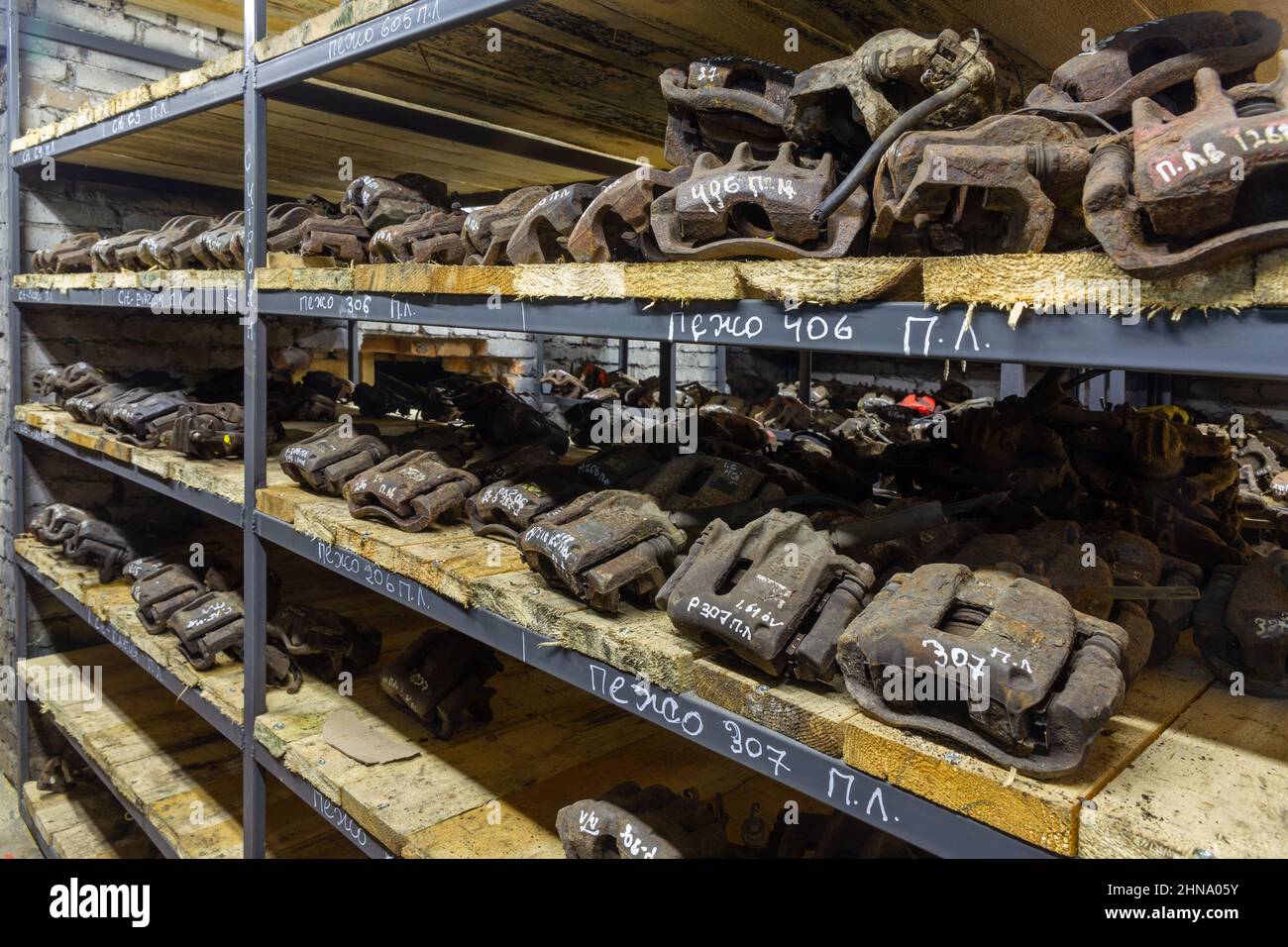 Used car parts on the factory shelf. Used auto parts for sale in a ...