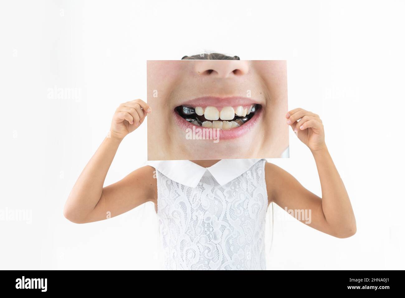 little girl showing her healthy teeth at dental office, smiling and ...