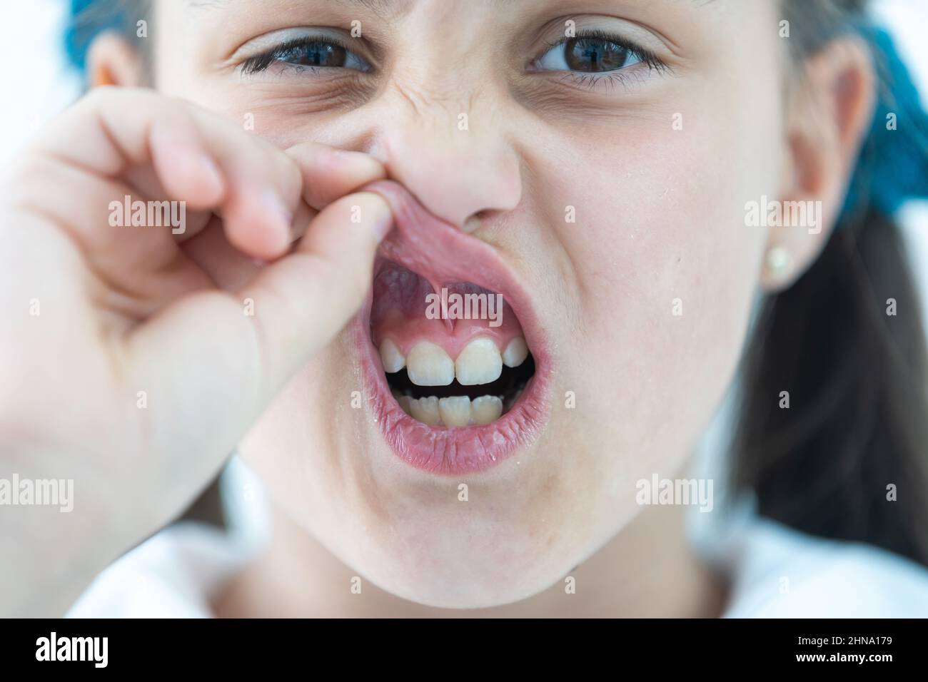 little girl showing her healthy teeth at dental office, smiling and ...