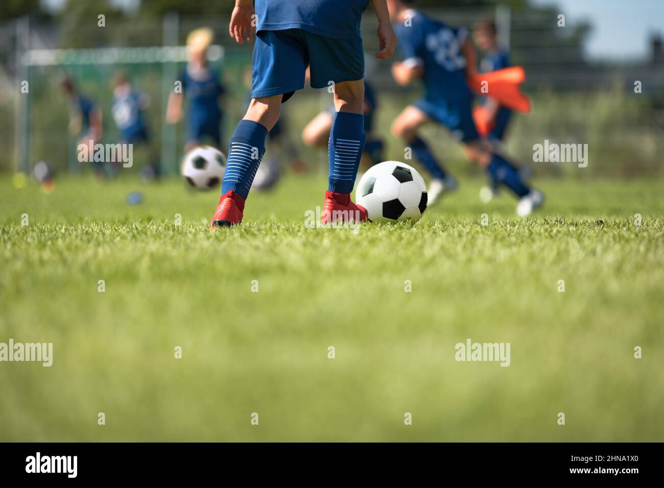 Group of kids practicing soccer at grass school yard. Children playing ...