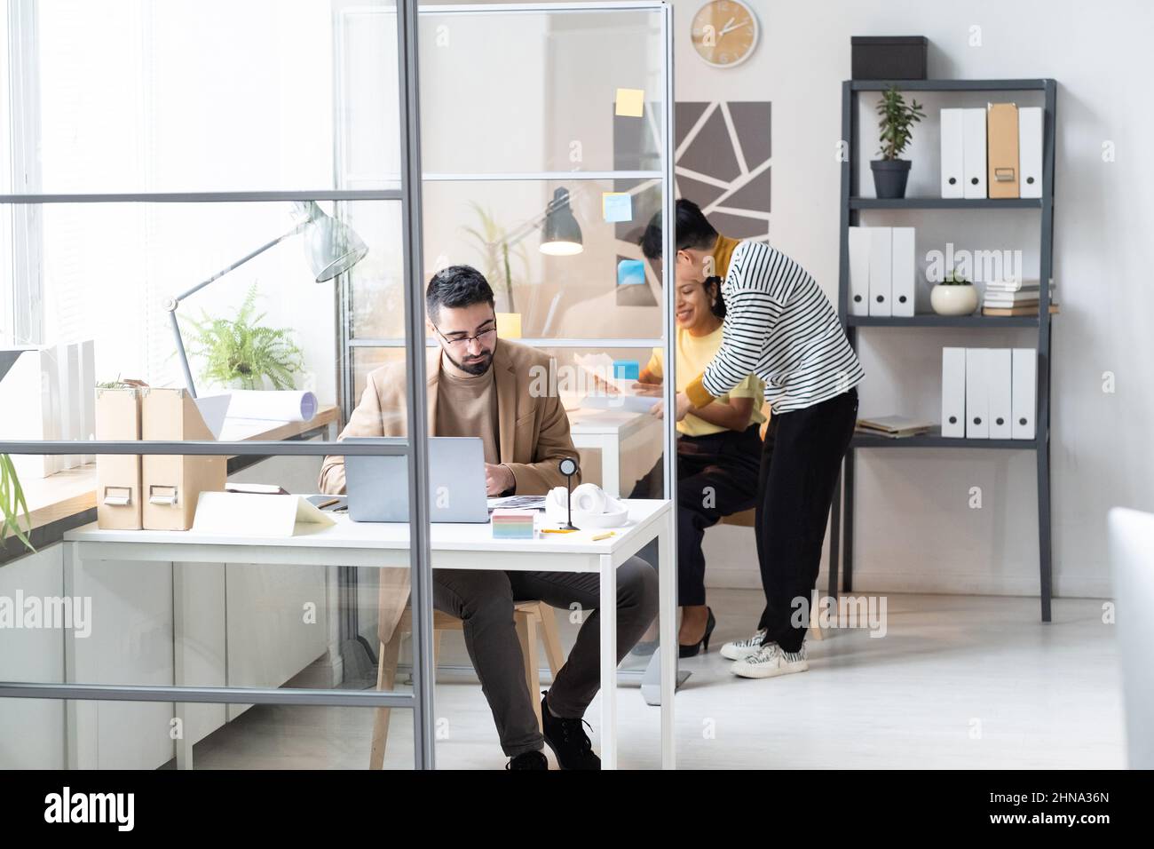 Young business people cooperating together at modern office, they ...