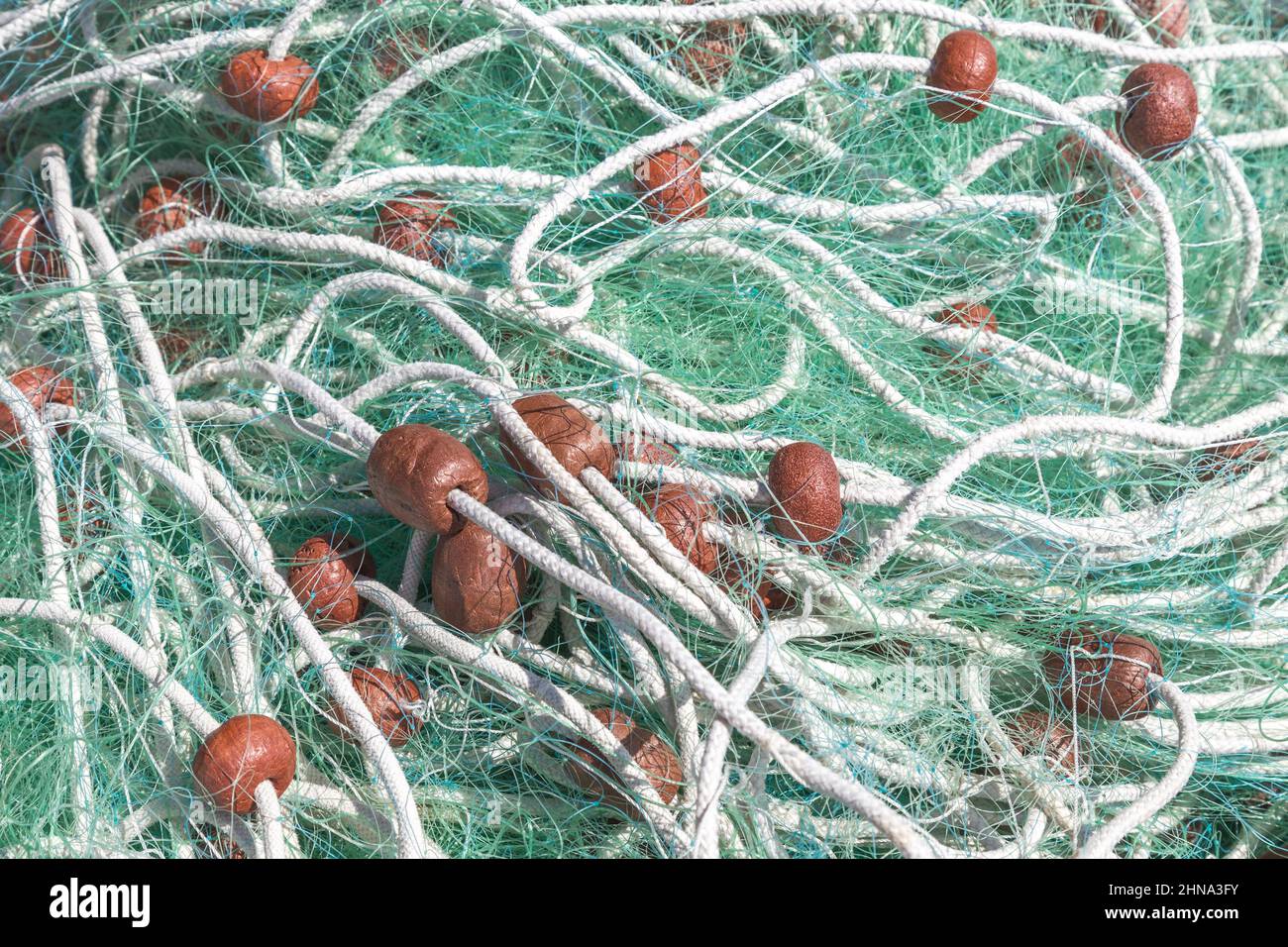 A fishing net creating a background with texture Stock Photo - Alamy