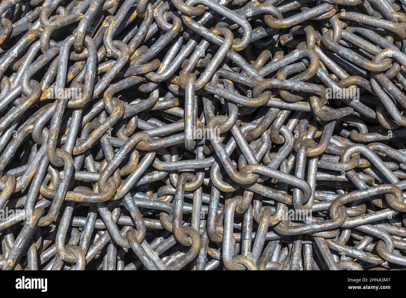 Iron chain, large stack creating texture background Stock Photo - Alamy