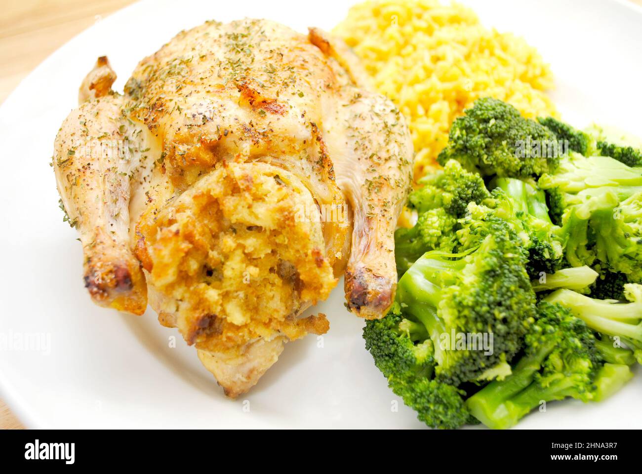 A Plated Whole Roasted Game Hen with Healthy Sides Stock Photo - Alamy