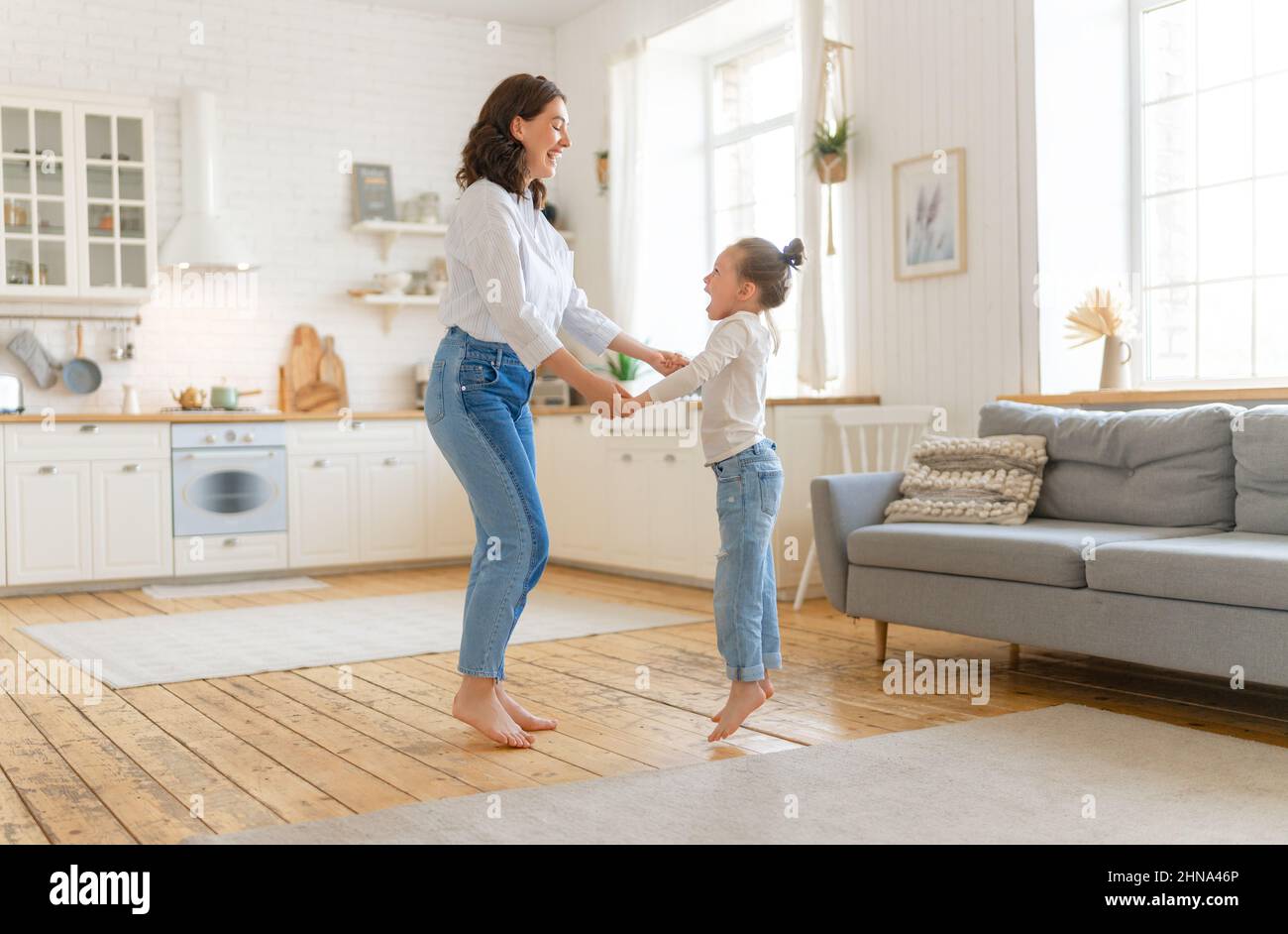Mom and her daughter child girl are dancing. Family holiday and ...