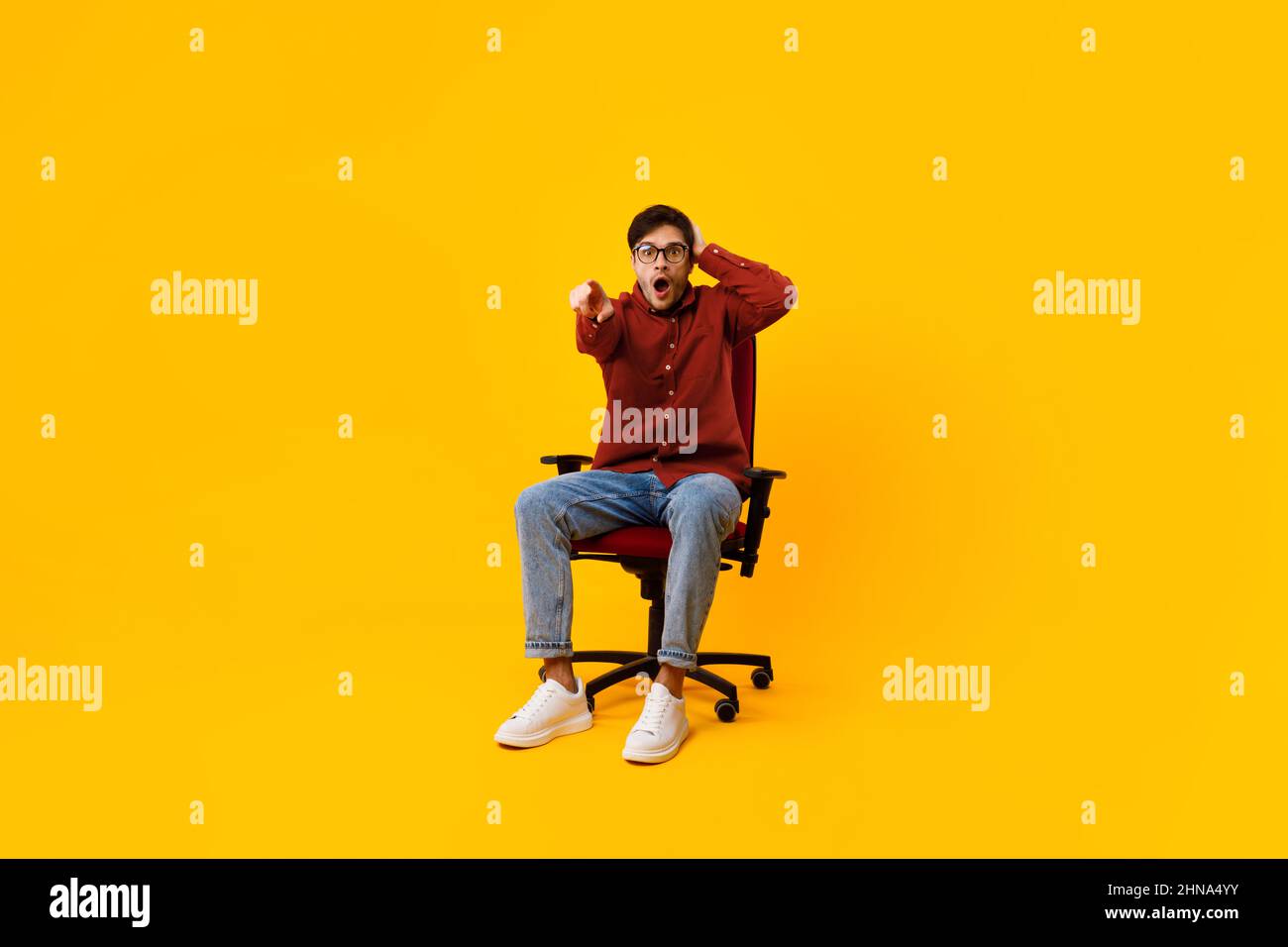 Shocked male business person pointing hi-res stock photography and ...