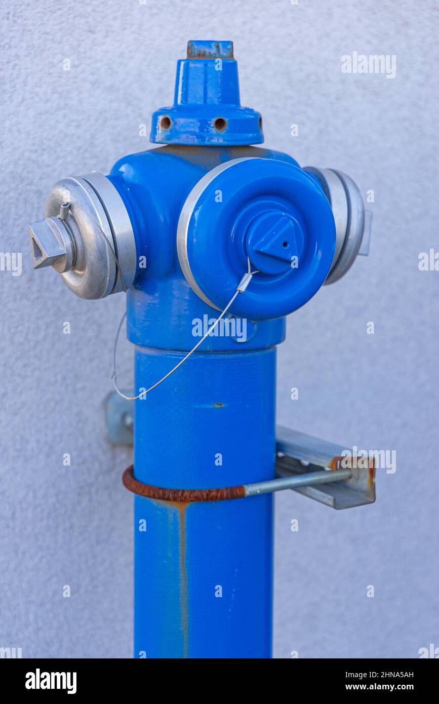 Blue Water Pipe Fire Hydrant With Rusty Holder Stock Photo - Alamy