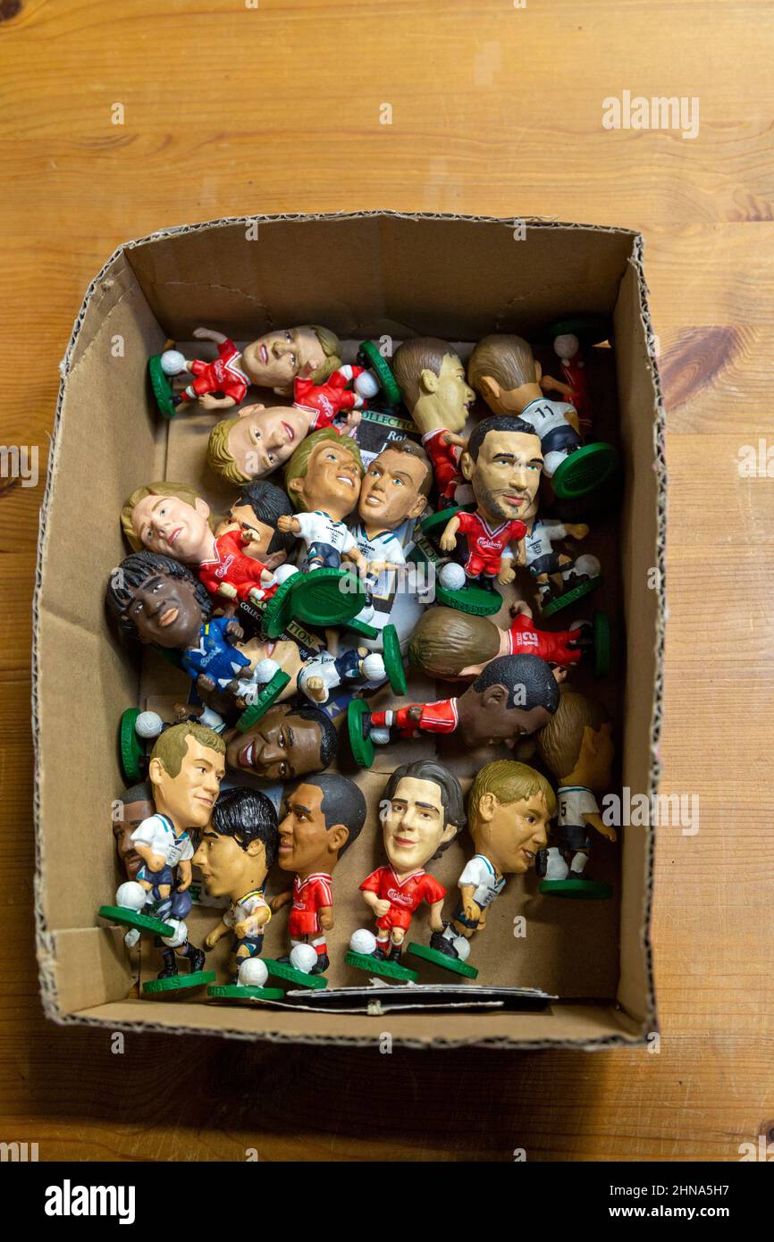 Plastic models of football players in cardboard box, UK Stock Photo - Alamy