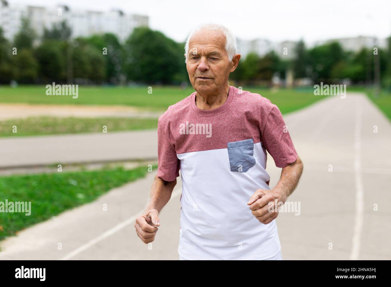 Running pensioner man hi-res stock photography and images - Alamy