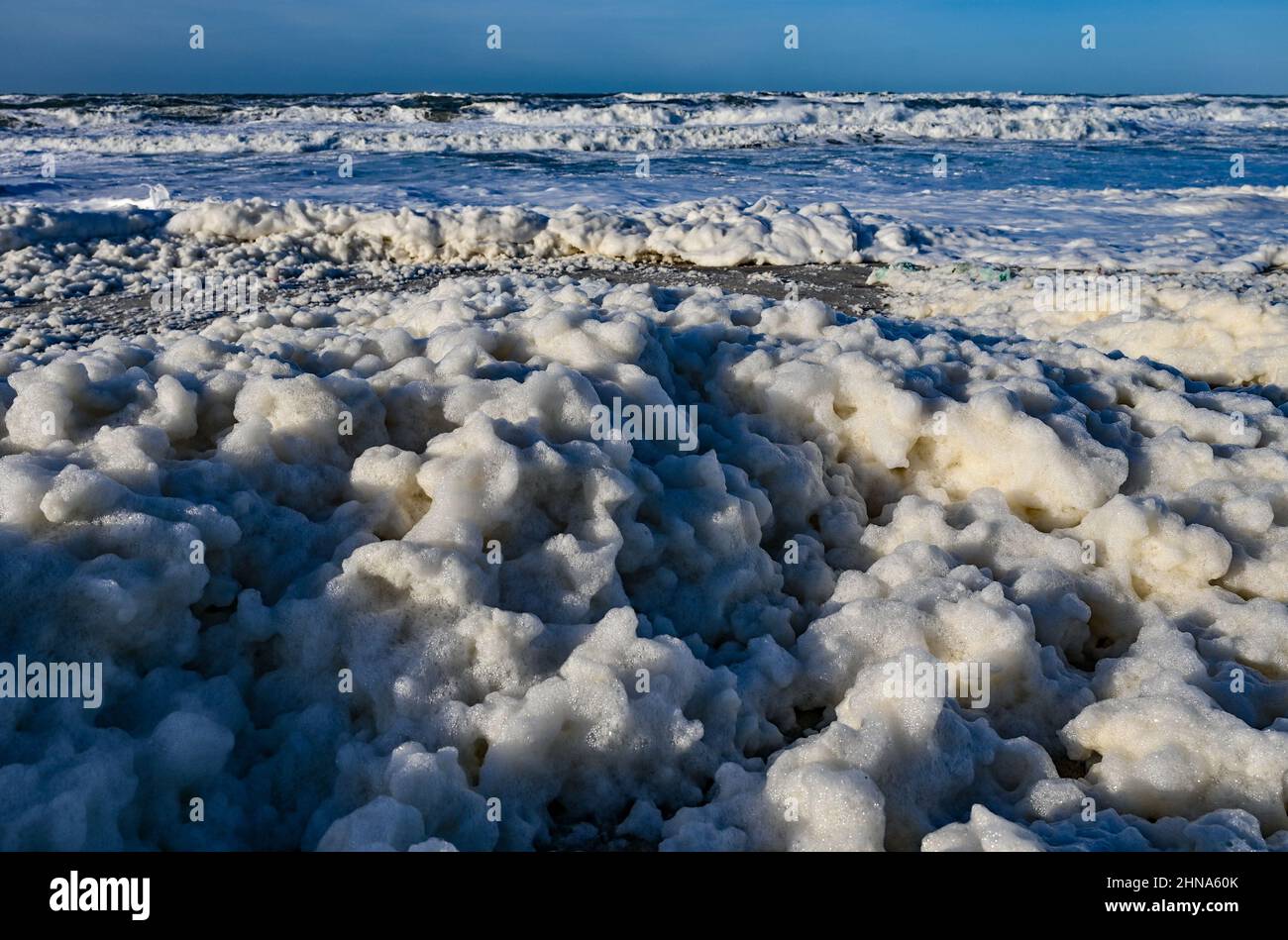 30 January 2022, Denmark, Klitmöller: A lot of foam from the surf of ...
