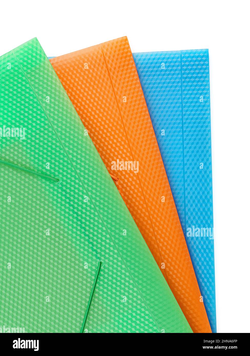 Three multi-colored folders for papers close up. Isolated on white ...