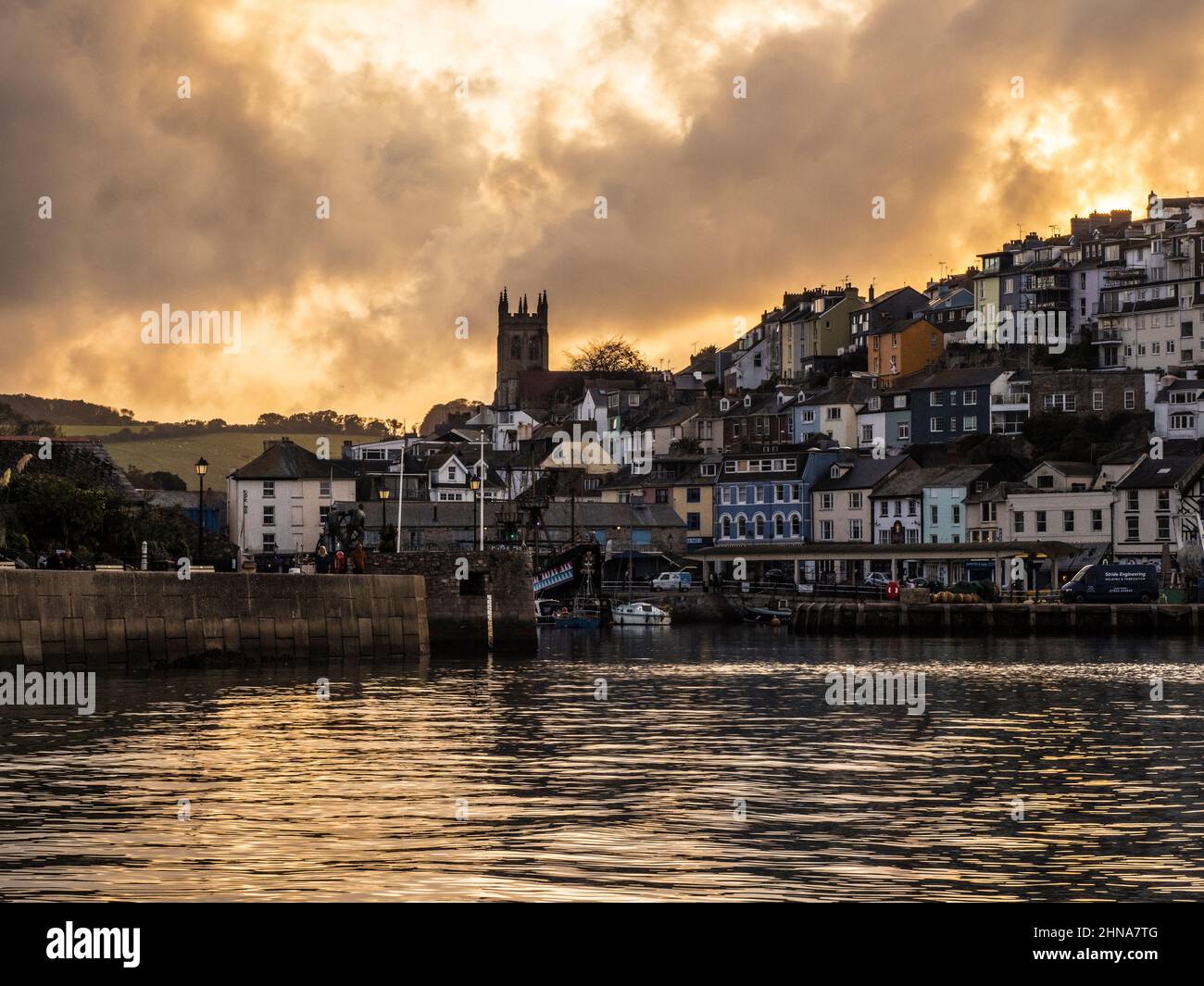 A dramatic stormy sunset over All Saints' Church in Brixham, Devon ...