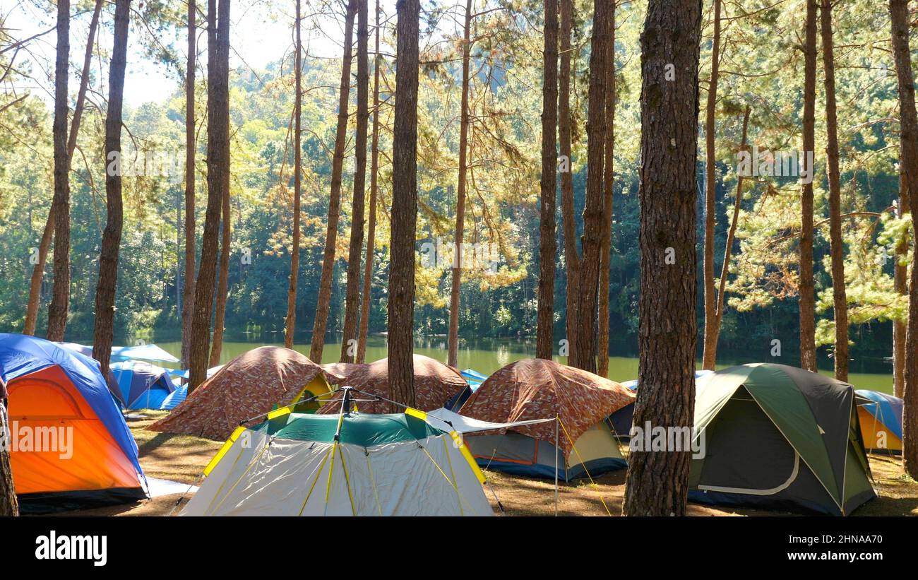 Getting away from urban life to natural environment. Tents camping area ...