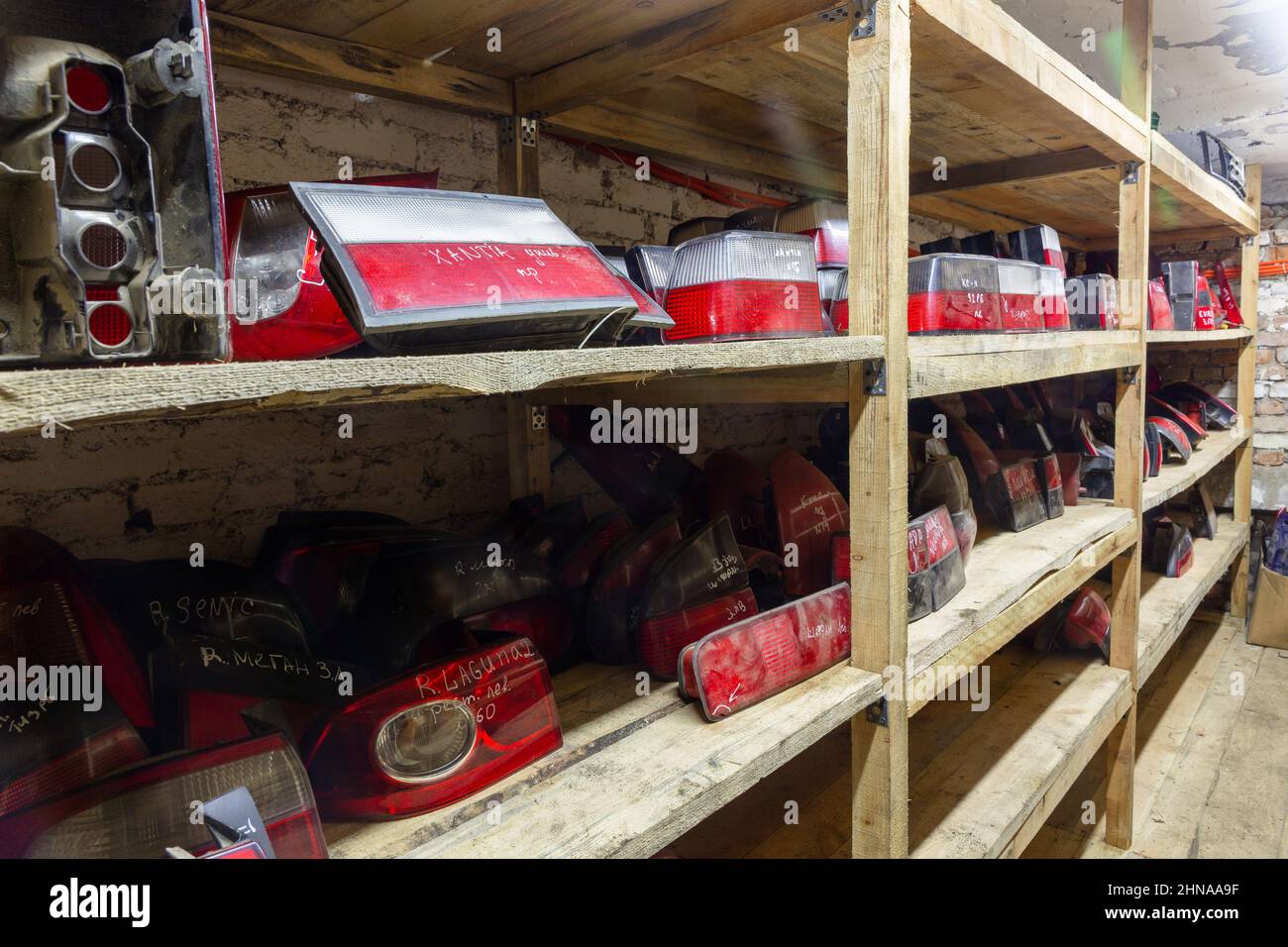 Used car parts on the store shelving. Used auto parts for sale in a ...