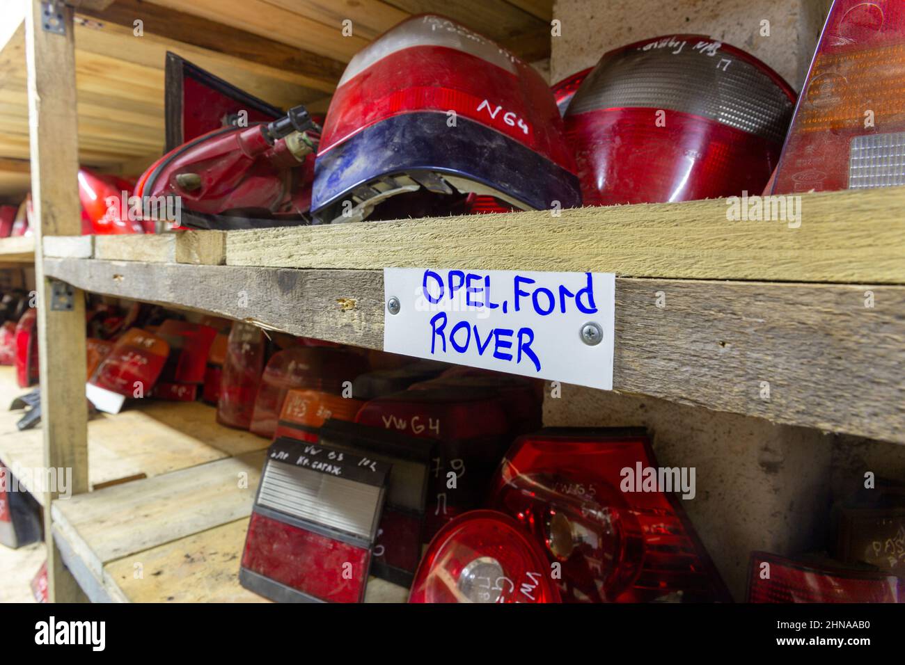 Used car parts on the store shelving. Used auto parts for sale in a ...