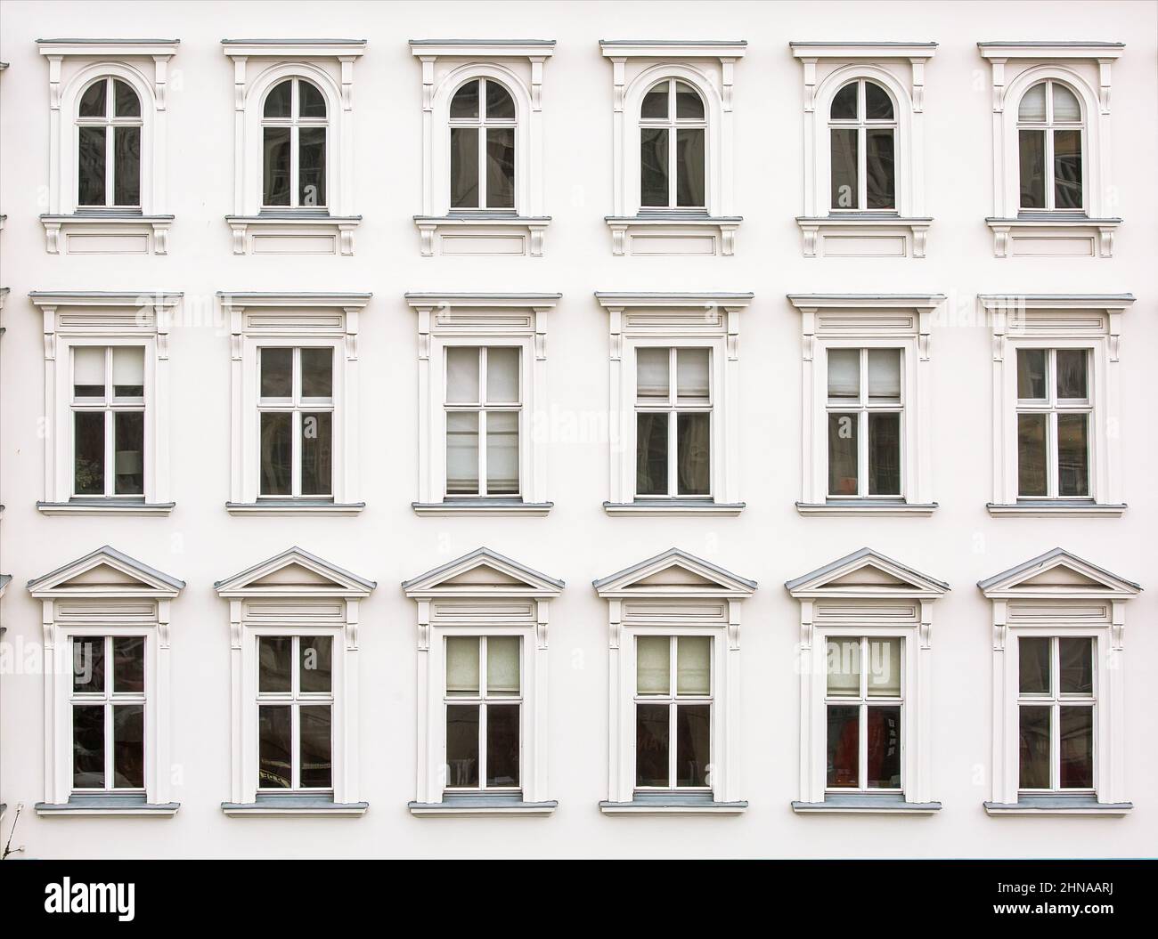Rows of windows on white facade of the building, architectural ...