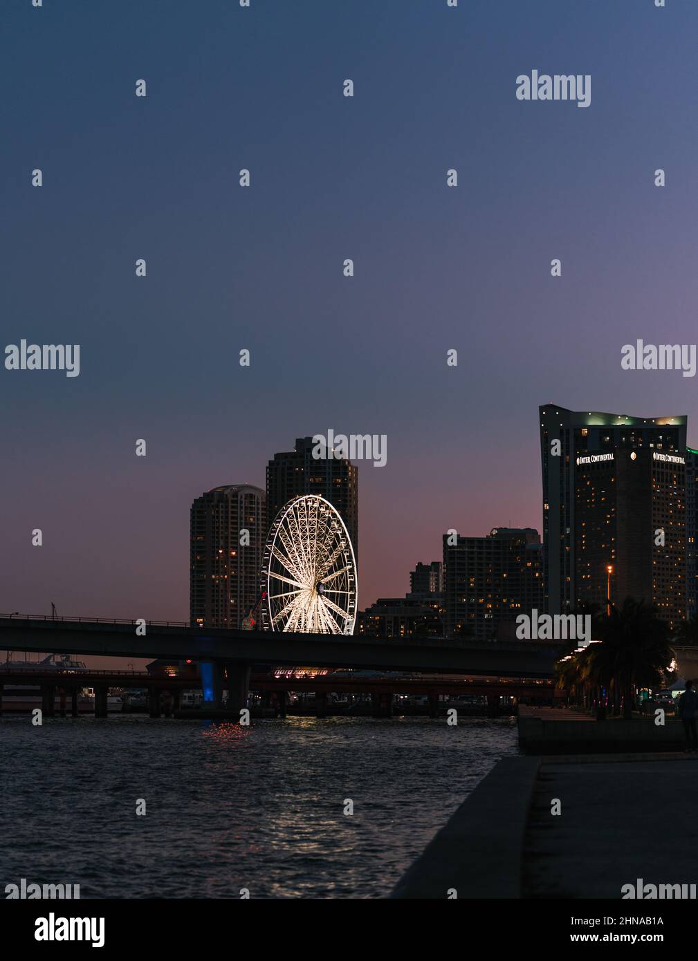 wheel views miami city sunset sea colors Stock Photo - Alamy