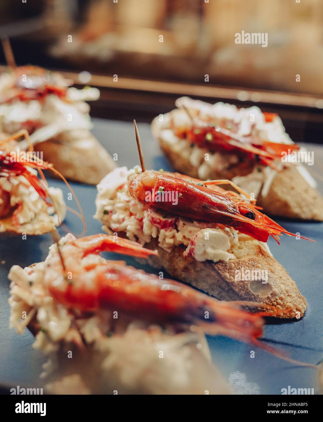 Different assorted canapes of bread with crab, ham and vegetables Stock ...