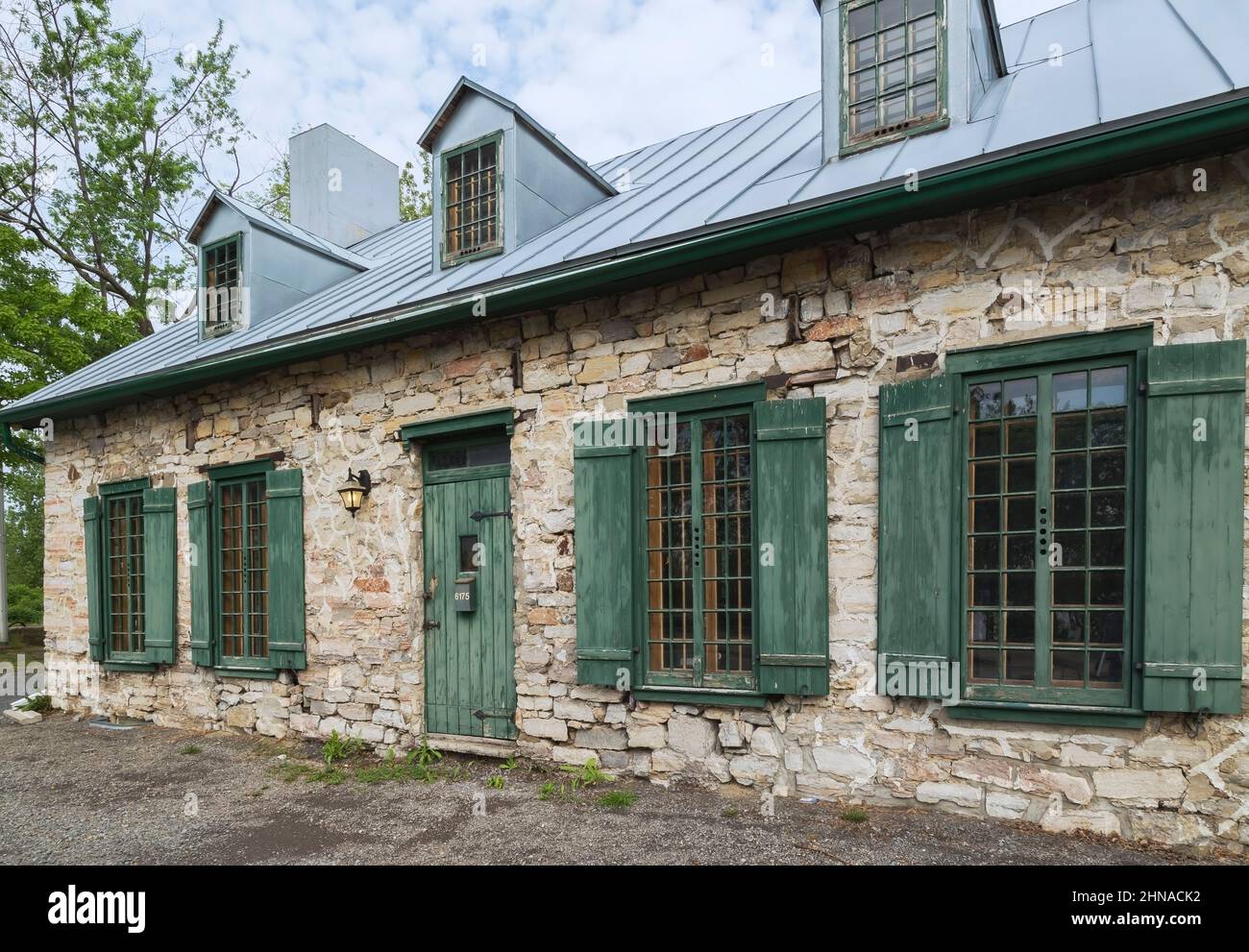 Old circa 1750 fieldstone house known as the Maison Labelle with grey ...