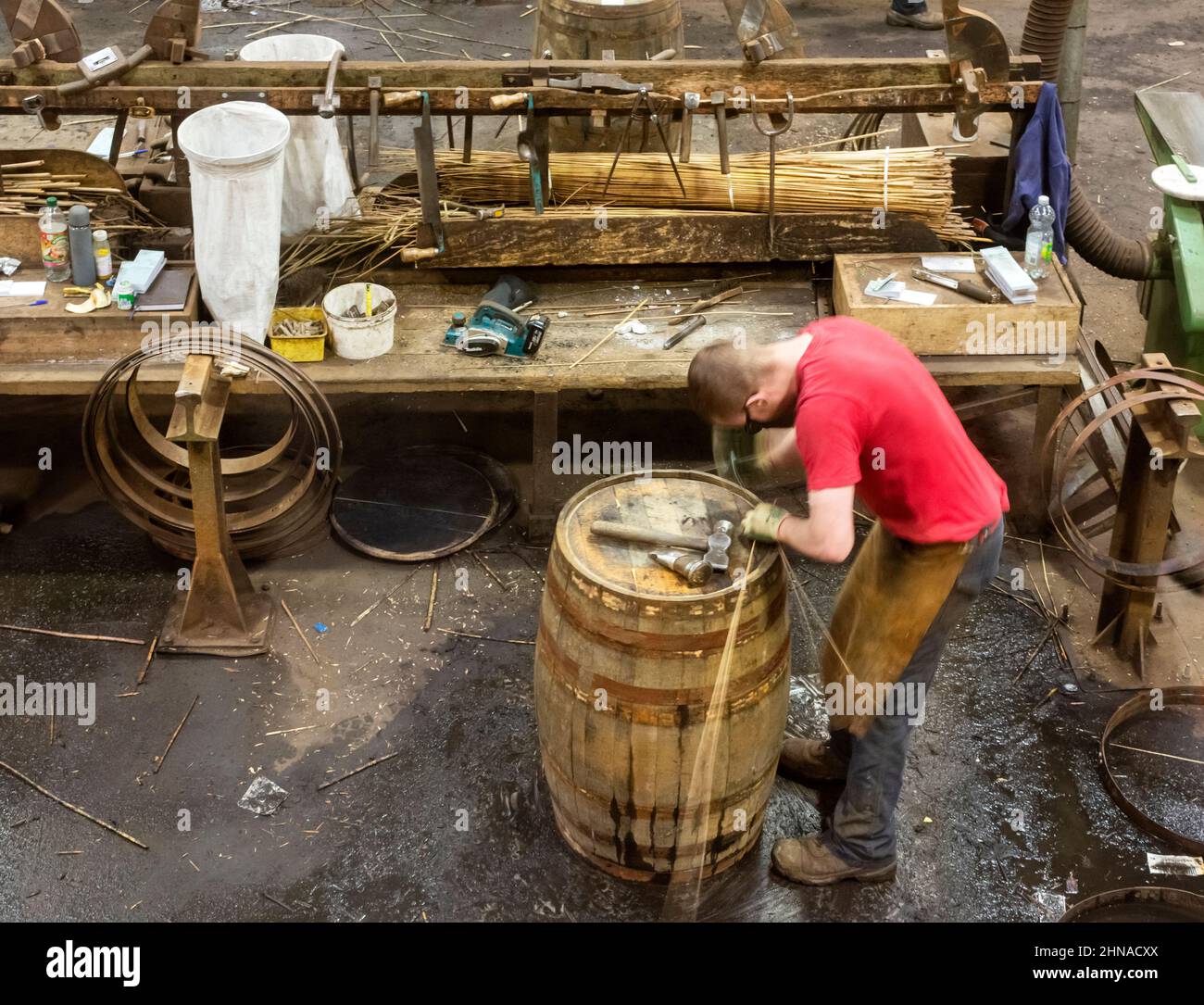 SPEYSIDE COOPERAGE CRAIGELLACHIE SCOTLAND A COOPER SEALING THE WHISKY ...