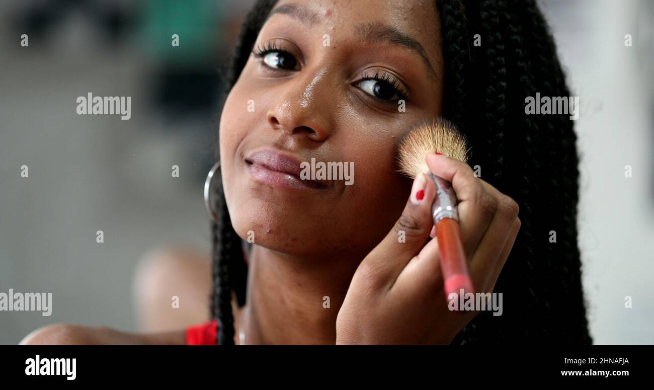 Portrait smiling teenage girl applying makeup hi-res stock photography ...