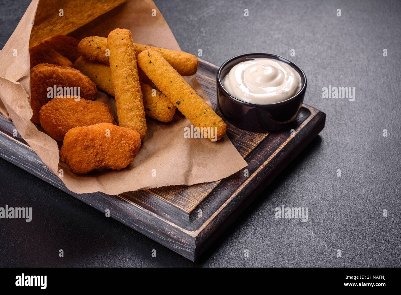 Fried crispy nutritious cheese or potato sticks. Snacks for beer Stock ...