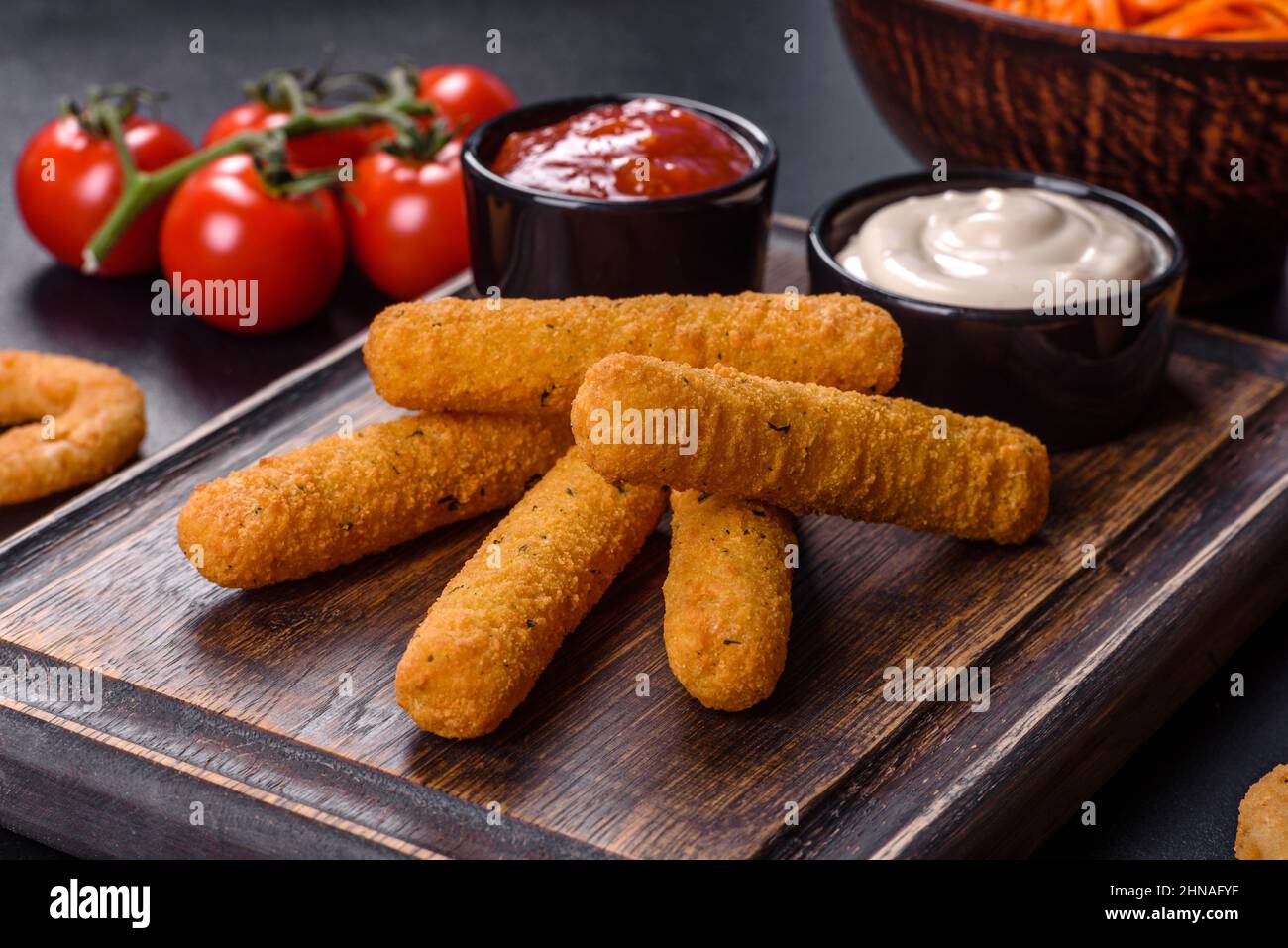 Fried crispy nutritious cheese or potato sticks. Snacks for beer Stock ...