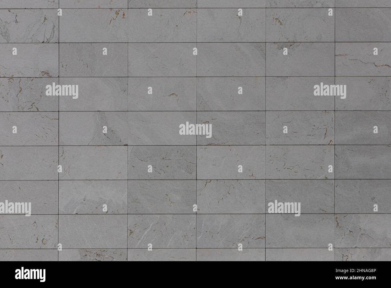 Background of gray and brown stone concrete wall made of blocks. Wall ...