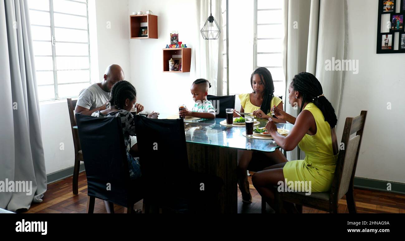 Black African family eating lunch together Stock Photo - Alamy