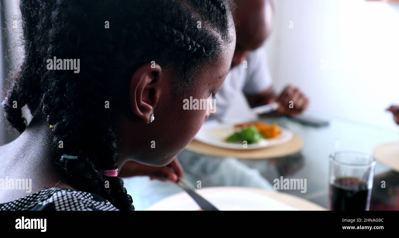 Black African family eating lunch together Stock Photo - Alamy
