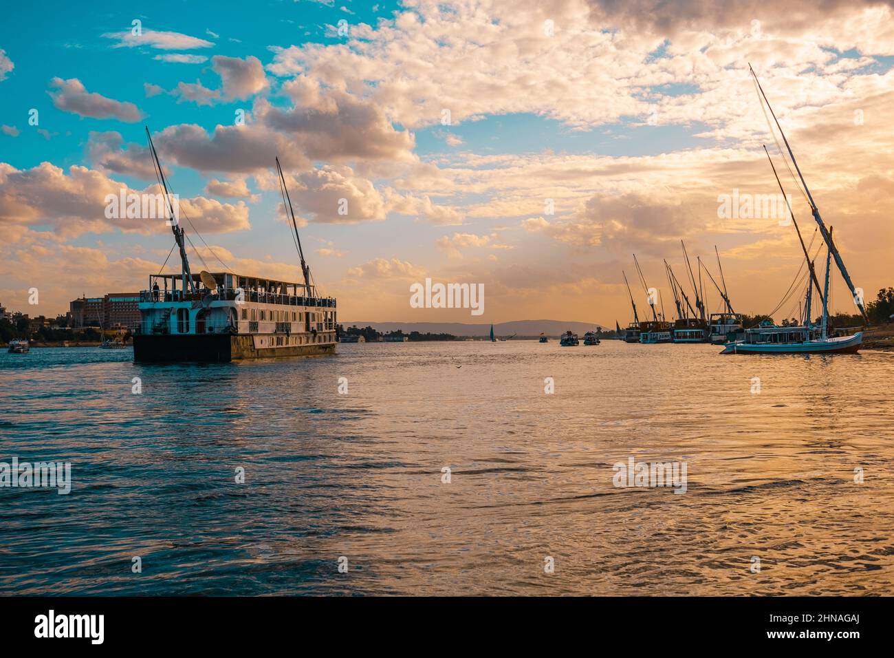 Cruise ship cruising down the river nile, around the luxor area. Famous ...